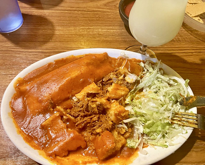 These tamales aren't just wrapped in corn husks&mdash;they're wrapped in tradition. The red sauce practically sings mariachi while the shredded chicken does the dancing.