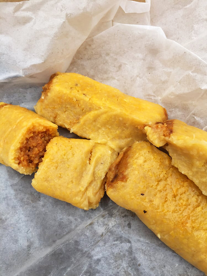Golden-hued tamales waiting to be devoured. These humble corn treasures are the unsung heroes of Johnnie's menu.