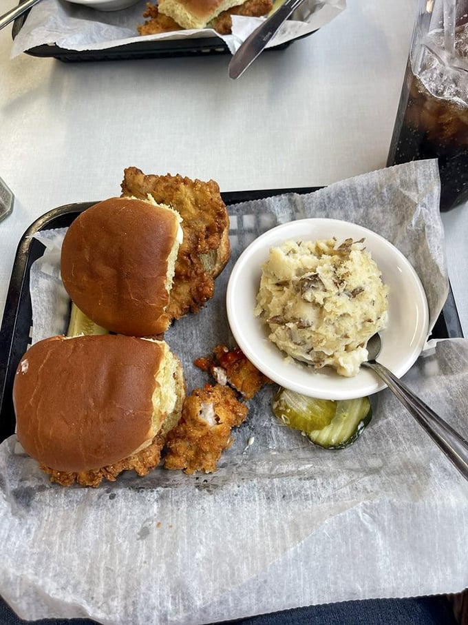 The Indiana state sandwich in all its glory&mdash;a breaded tenderloin that refuses to acknowledge the boundaries of its bun, paired with fries that could make a Frenchman weep.