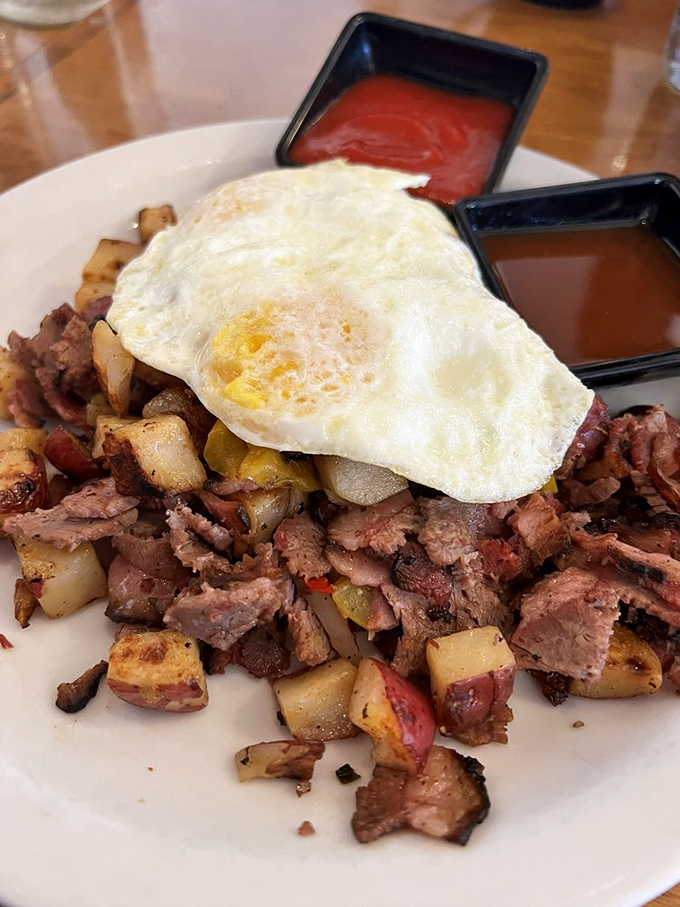 The Texas Hash transforms humble ingredients into morning magic, crowned with an egg that's perfectly sunny-side up.