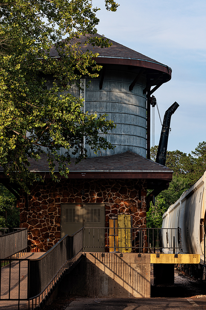 This isn't just a water tower; it's a time machine disguised as industrial architecture, standing sentinel over decades of railroad history.