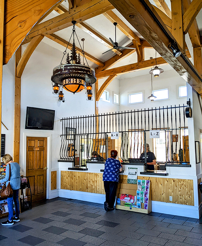 Rustic elegance meets frontier functionality in this ticket area, where adventures begin beneath timber beams and custom lighting.