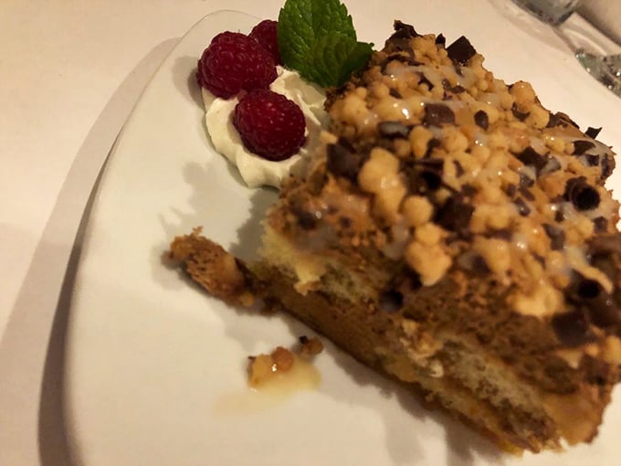 Tiramisu topped with fresh raspberries and whipped cream, because sometimes dessert needs to look as heavenly as it tastes.