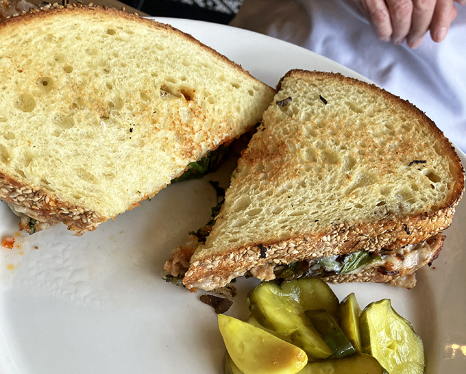 A sandwich isn't just lunch &ndash; it's architecture. This tuna melt's golden exterior gives way to melty perfection that would make any deli owner weep with joy.