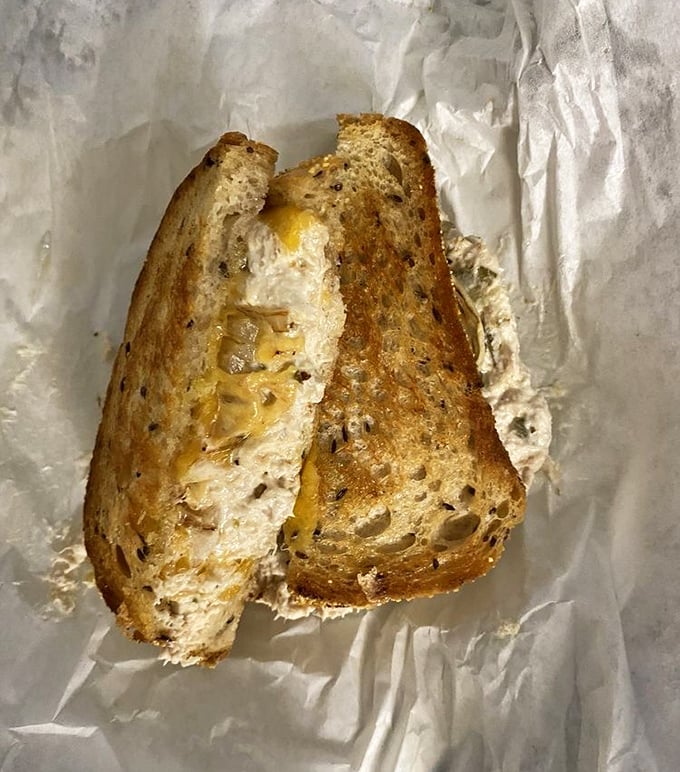 The grilled cheese reveals itself like a melty treasure chest &ndash; perfectly toasted bread giving way to a gooey interior that would make any comfort food lover weak in the knees.