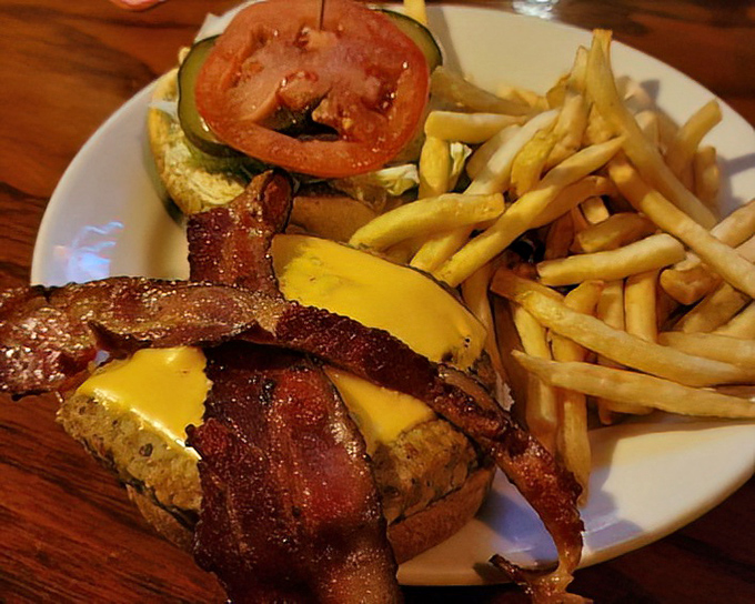 Bacon, cheese, and a perfectly charred burger create the holy trinity of comfort food. The Flying Pig proves Cincinnati knows how to elevate the humble hamburger.
