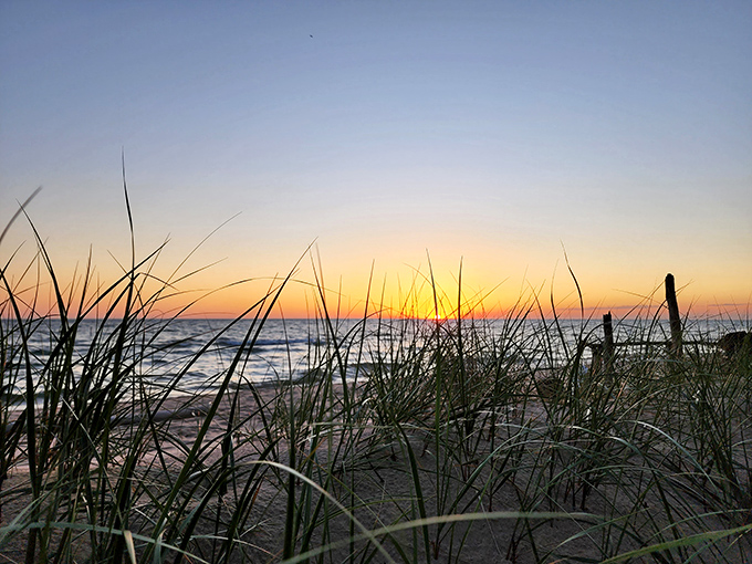 Mother Nature's mood lighting at its finest. When the sun dips below the horizon, the beach transforms into a canvas of amber and gold.