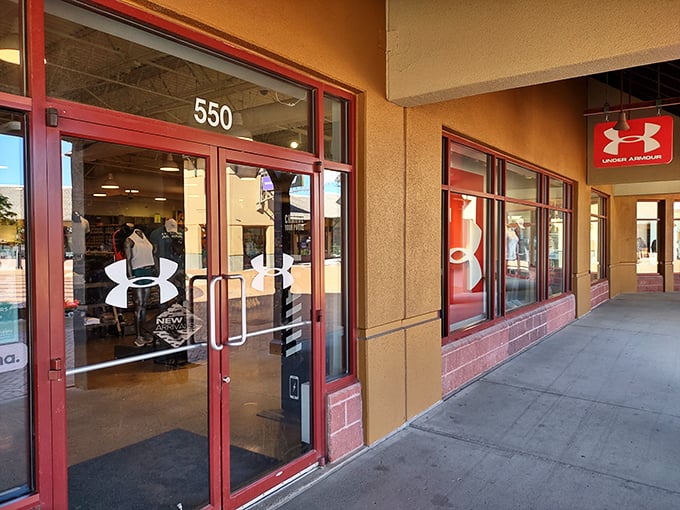 Under Armour's storefront promises athletic gear that might actually inspire you to use that gym membership. The red accents say "serious business" for serious discounts.