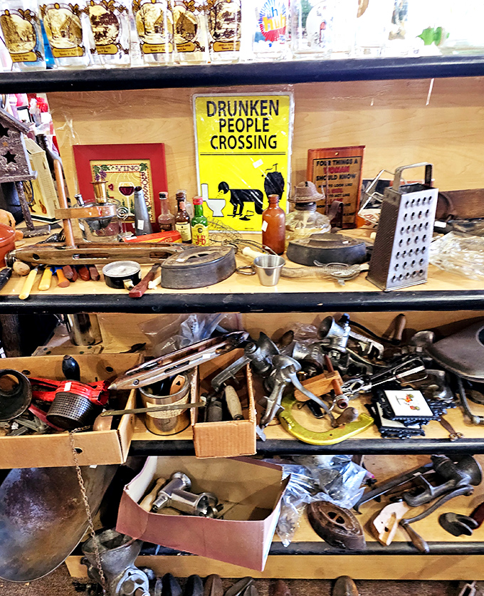 The kitchen tool section: where vintage potato mashers and cheese graters go to find their second act, alongside that "Drunken People Crossing" sign you didn't know you needed.