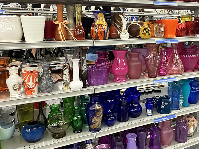 A rainbow of glass vessels standing at attention, like colorful soldiers guarding memories of centerpieces and windowsill gardens.