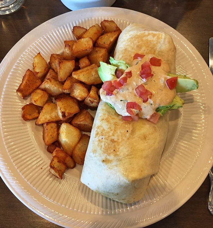 Breakfast burritos: where morning meets Mexico in a tortilla hug. Those home fries look like they've achieved the perfect crisp-to-tender ratio.
