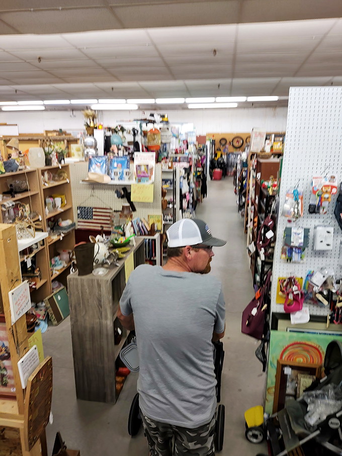 Fellow treasure hunters navigate the narrow aisles with purpose. The focused expression of someone who just spotted that one missing piece from their collection.