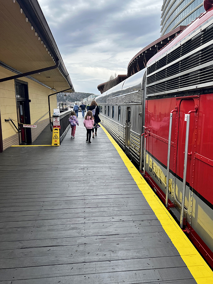 The platform buzzes with anticipation as families embark on their railway adventure&mdash;childhood memories in the making.