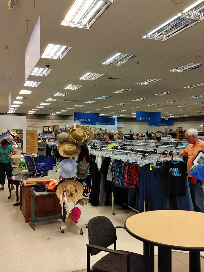 Shoppers navigate the well-organized aisles like explorers charting new territory in the land of secondhand finds.