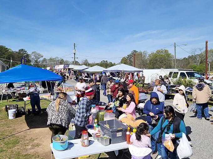 The crowd gathers around food vendors like a modern tribal ritual&mdash;because nothing builds shopping stamina like a paper plate of something delicious.