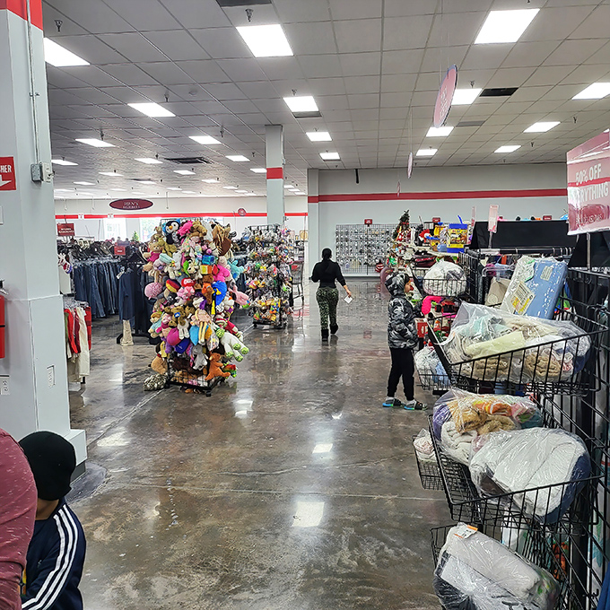 The stuffed animal tower rivals the Houston skyline, a colorful monument to childhood nostalgia amid the bustling shopping floor.