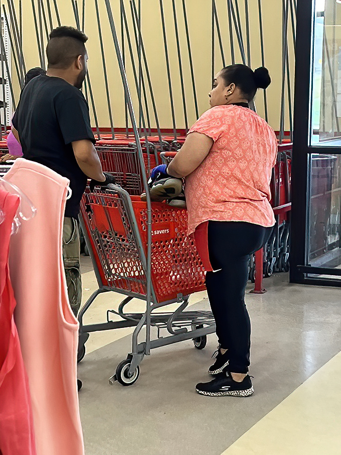 The red shopping carts stand ready for adventure &ndash; modern-day treasure chests on wheels for the savvy thrift explorer.