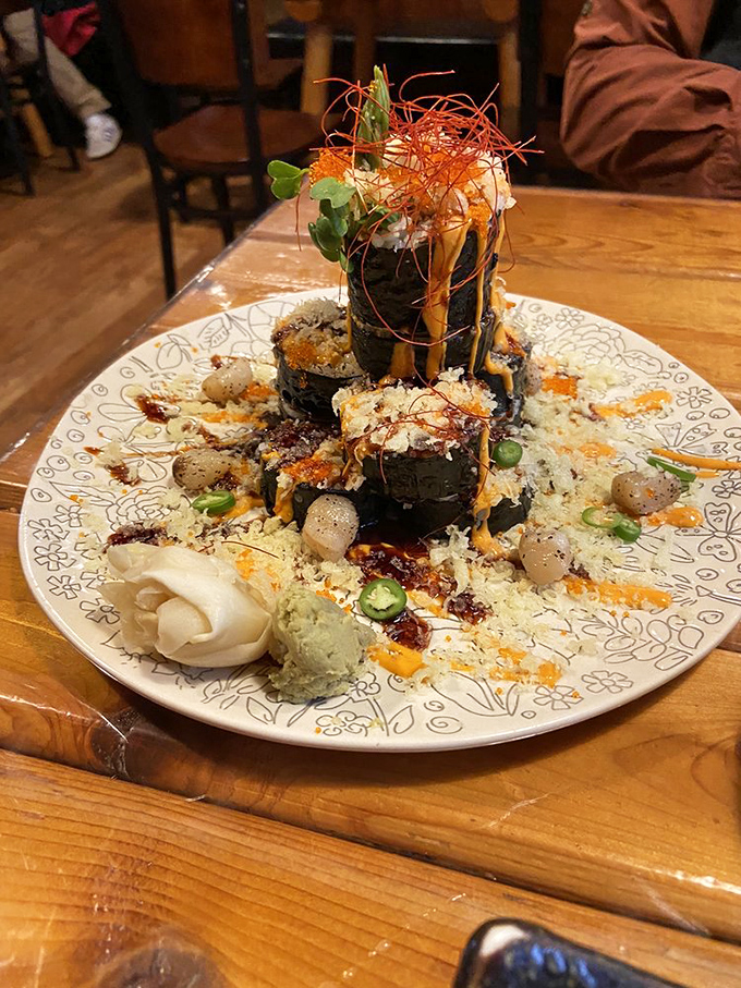 This architectural marvel of sushi isn't just food &ndash; it's edible art that almost feels criminal to dismantle.