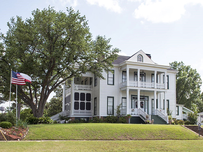 The W.P. Schluter House stands proudly in its white-columned glory, a Southern belle of architecture that never goes out of style.