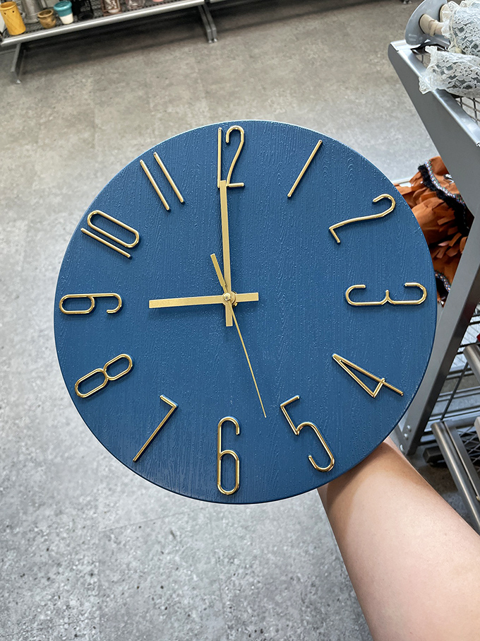 Time literally stands still at these prices. This stylish blue clock with gold numerals could be keeping track of your savings instead of hours.