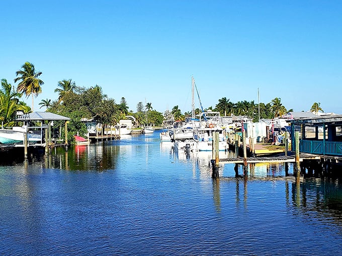 Boats bob gently in Matlacha's canals, a watery neighborhood where mailboxes are dock posts and driveways are made of rippling blue.