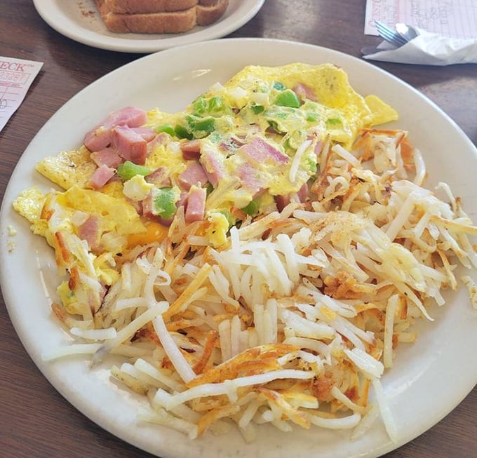 The Western omelet and hash browns&mdash;a dynamic duo that puts most superhero partnerships to shame. Crispy, fluffy, savory perfection on a plate.
