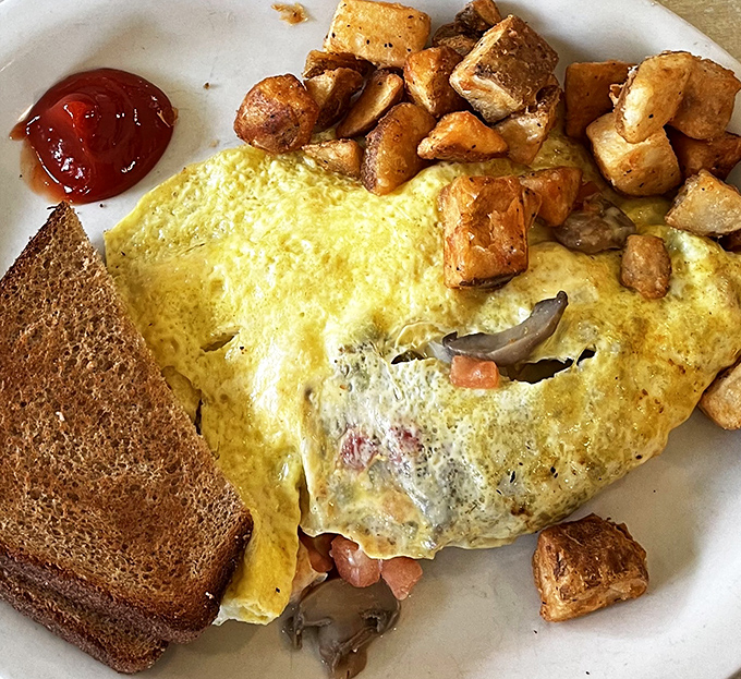 An omelet that doesn't just contain vegetables&mdash;it celebrates them. Those home fries on the side? They're the supporting actors who deserve their own Oscar.