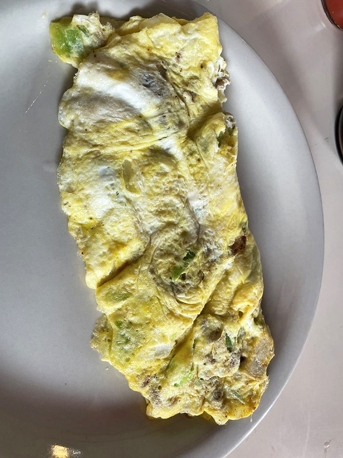 Behold the Western omelet in its natural habitat&mdash;a fluffy yellow landscape where peppers and ham live in perfect harmony.