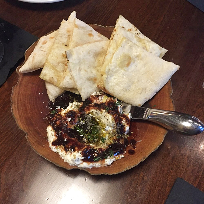 Whipped ricotta with pita triangles—proof that sometimes the simplest combinations create the most profound happiness. Like finding money in old jeans, but tastier.