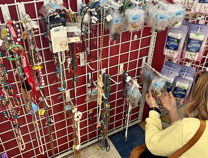 Colorful jewelry and accessories dangle like fishing lures, tempting shoppers to add that perfect finishing touch to their thrifted ensemble.