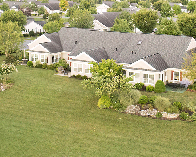 From this aerial view, the cottages nestle together like a community that actually remembers what "community" means.