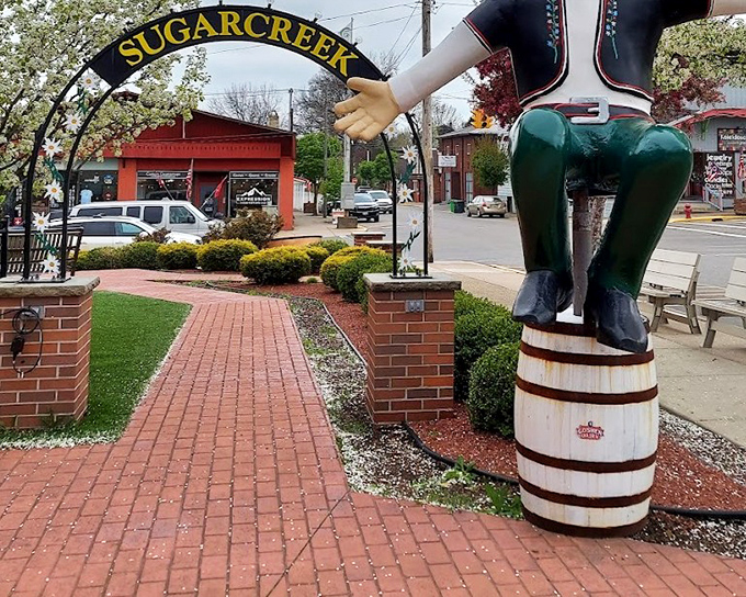 This charming figure perched atop a barrel reminds us that before smartphones, we entertained ourselves with statues of people doing everyday tasks.
