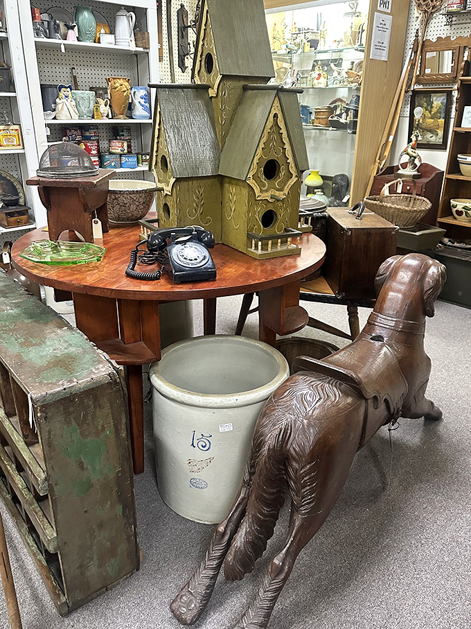 A whimsical arrangement featuring vintage telephones, elaborate birdhouses, and a wooden horse that's seen more history than most history books contain.