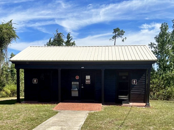 Even the facilities at Torreya blend seamlessly into the landscape. Rustic charm meets modern necessity in this woodland restroom.