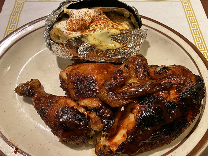 Barbecued chicken with that perfect mahogany skin and a baked potato wrapped in foil like a delicious present waiting to be unwrapped. Simple pleasures, expertly executed.