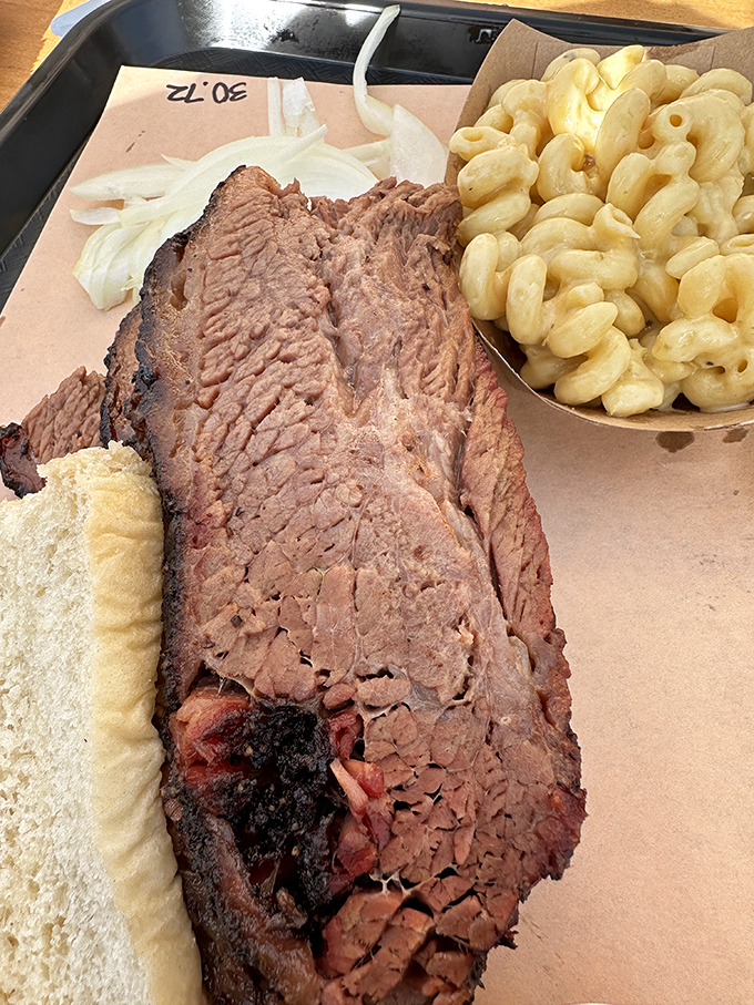 Brisket sliced thicker than a paperback novel, with a smoke ring that could make a pitmaster weep with joy.