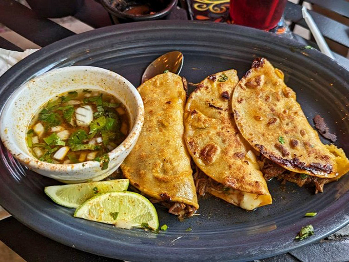 Birria tacos: where crispy meets tender, where cheese meets meat, where you meet happiness. Don't forget that crucial consomm&eacute; dip!