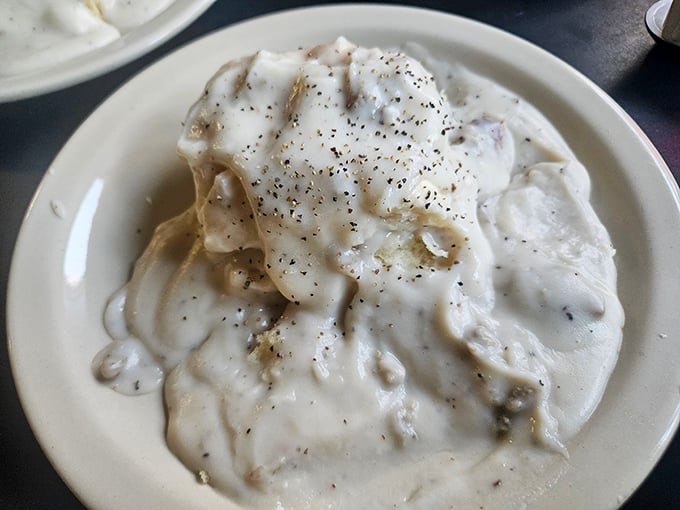 Gravy so perfectly peppered and creamy it could make a vegetarian question their life choices. This is what breakfast dreams are made of.