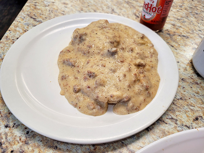 Biscuits swimming in peppery gravy with chunks of sausage &ndash; breakfast's answer to "What does a hug taste like?" Pure Hoosier comfort.