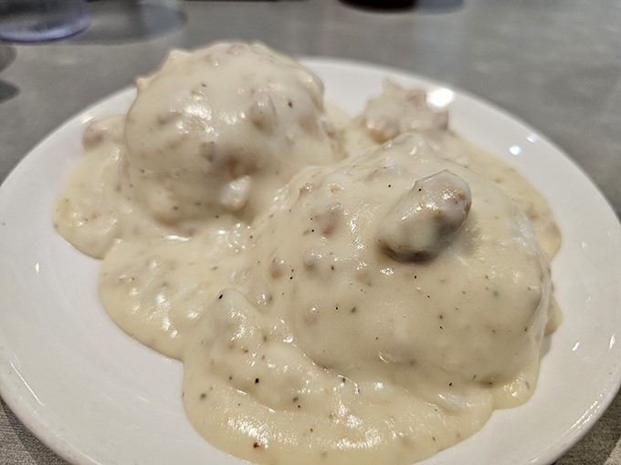 Biscuits and gravy that don't just smother&mdash;they embrace. This plate isn't food; it's a warm hug from your grandmother, if your grandmother was a culinary genius.