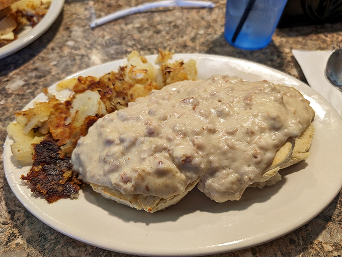 Biscuits smothered in sausage gravy&mdash;the kind of breakfast that makes you want to hug the cook and take a nap simultaneously.