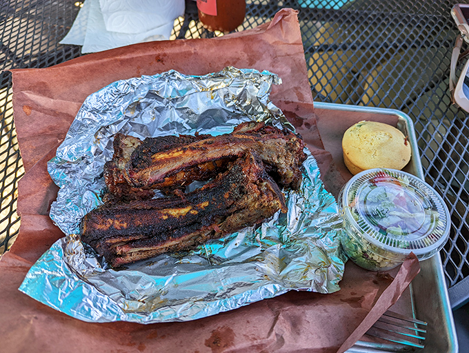 Bison ribs that look like they could've been served at a Flintstone family reunion. Prehistoric in size, revolutionary in flavor.