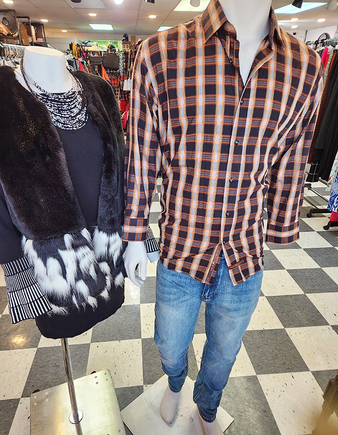 Fashion time travel: a plush fur-trimmed piece meets a classic plaid shirt. The '70s and '90s having a conversation on mannequins.