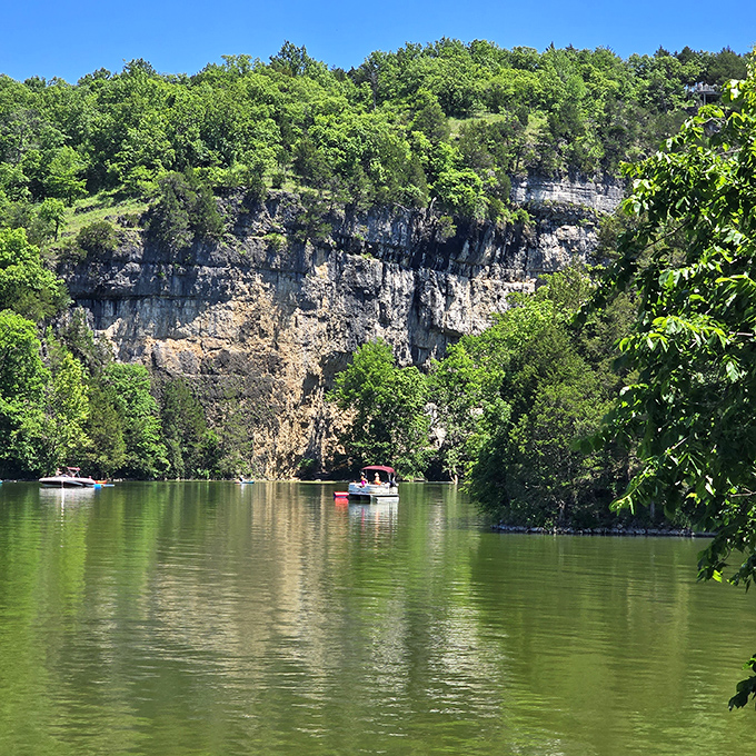 Limestone cliffs create nature's amphitheater for boaters exploring the lake. Like a geological Broadway, every seat offers a spectacular view.