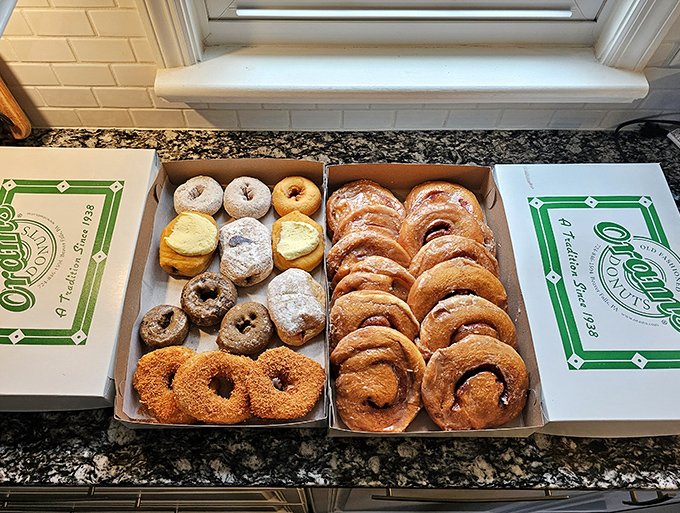 The ultimate care package: one side for experimental nibbling, one side dedicated entirely to those legendary cinnamon rolls. Strategic donut planning at its finest.