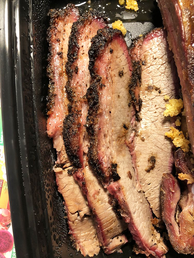 Brisket with that perfect pink smoke ring – the BBQ equivalent of finding the Hope Diamond in your backyard. Tender, smoky perfection.