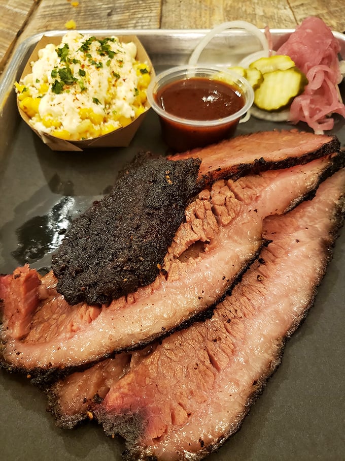Brisket so tender it practically surrenders to your fork. That smoke ring is the barbecue equivalent of a Michelin star.