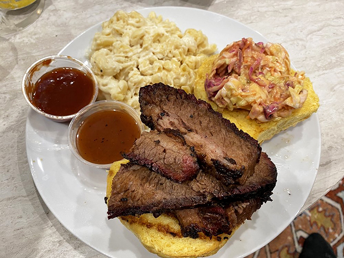 A plate that answers the eternal question: "What happens when perfectly smoked brisket meets mac and cheese and cornbread?" The answer: pure happiness.