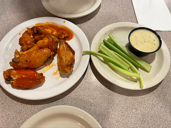 Buffalo wings with the perfect crisp-to-sauce ratio, served with cooling celery and blue cheese dip. Some food traditions need no improvement.