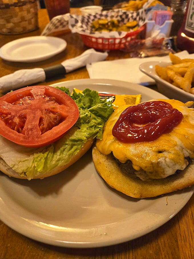 Even the burgers get the royal treatment here. That melty cheese blanket and fresh tomato slice? Supporting actors in a meaty masterpiece.